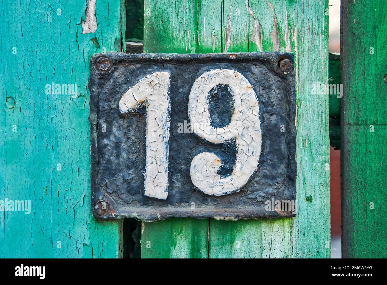 Old retro weathered cast iron plate with number 19 closeup Stock Photo ...