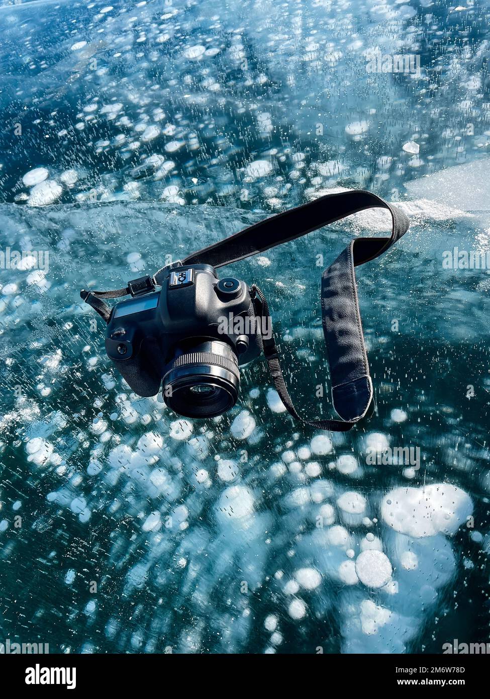 Professional photo camera on the ice of lake Baikal Stock Photo - Alamy
