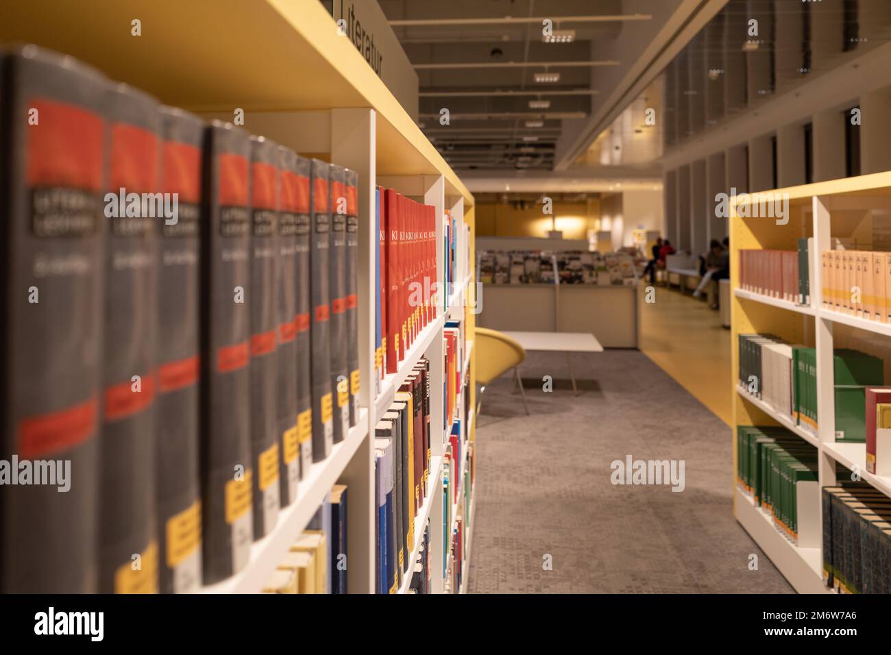 Selective focus and Interior view of corridor between row of bookshelf ...
