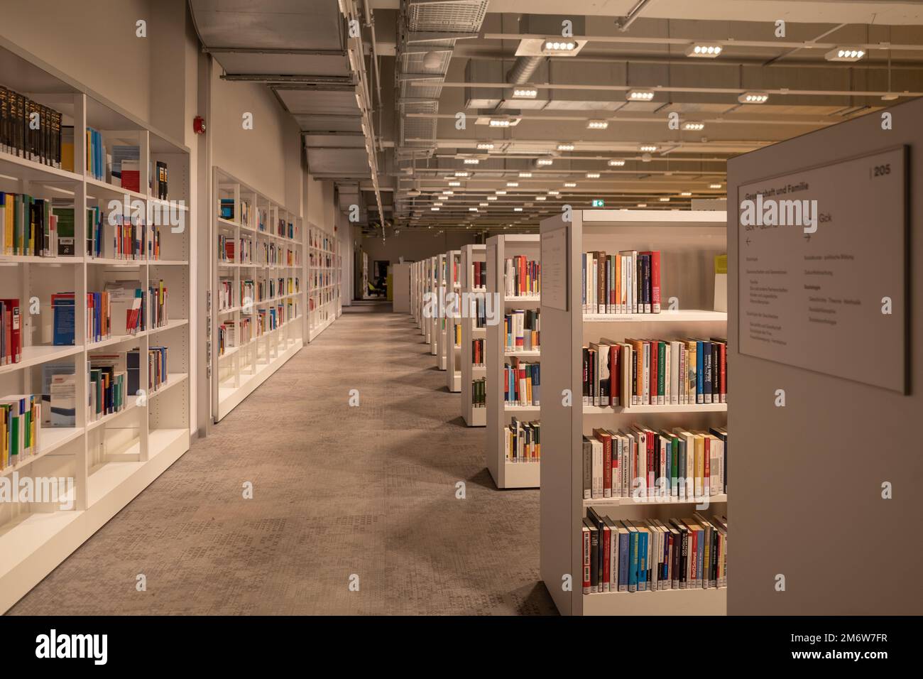 Selective focus and Interior view of corridor between row of bookshelf ...