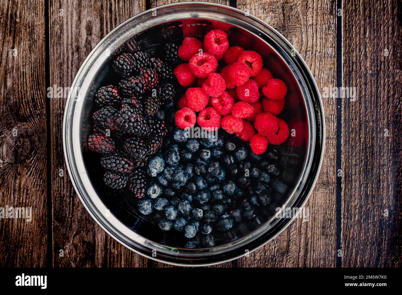 Blueberries, Raspberries, and Blackberries in a Mixing Bowl: A mixture ...