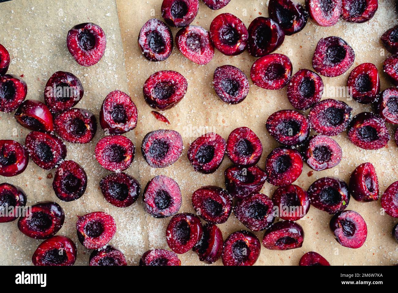 Raw Cherries Sprinkled with Sugar on a Parchment-Lined Sheet Pan ...