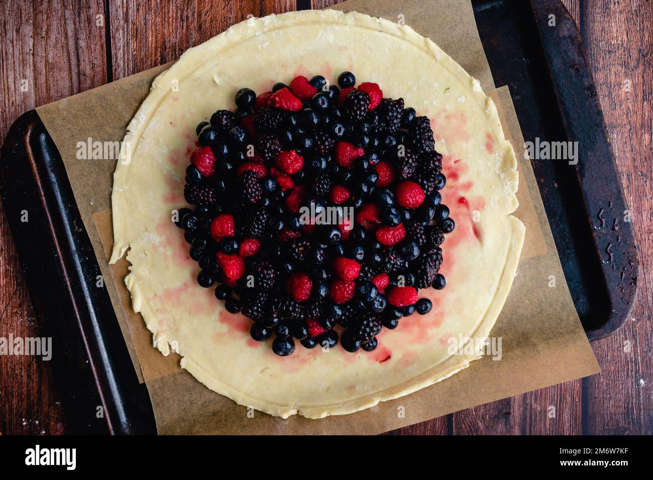 Assembling a Mixed Berry Galette on a Parchment-Lined Sheet Pan: Making ...