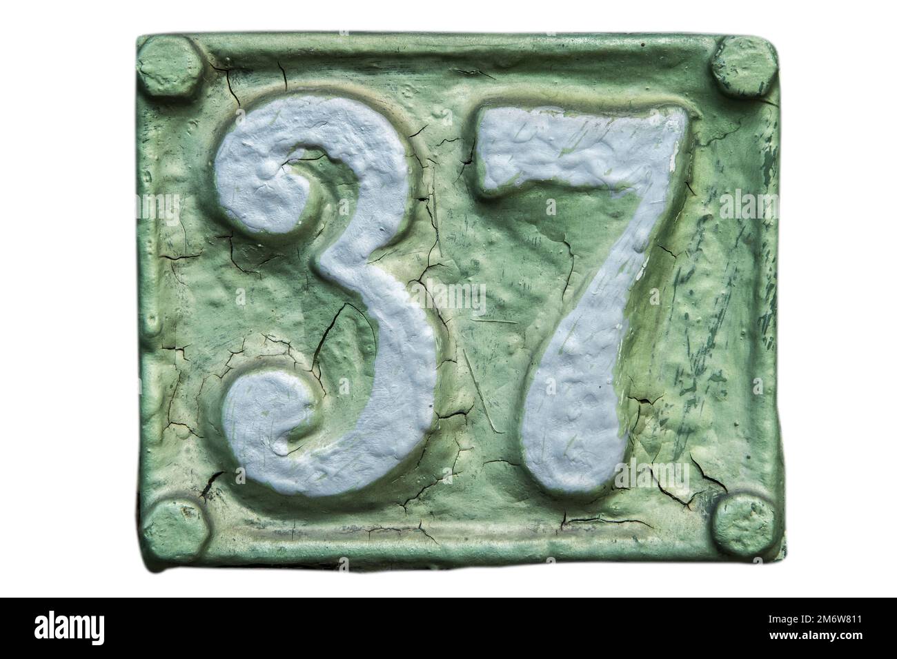 Old retro weathered cast iron plate with number 37 closeup isolated on ...