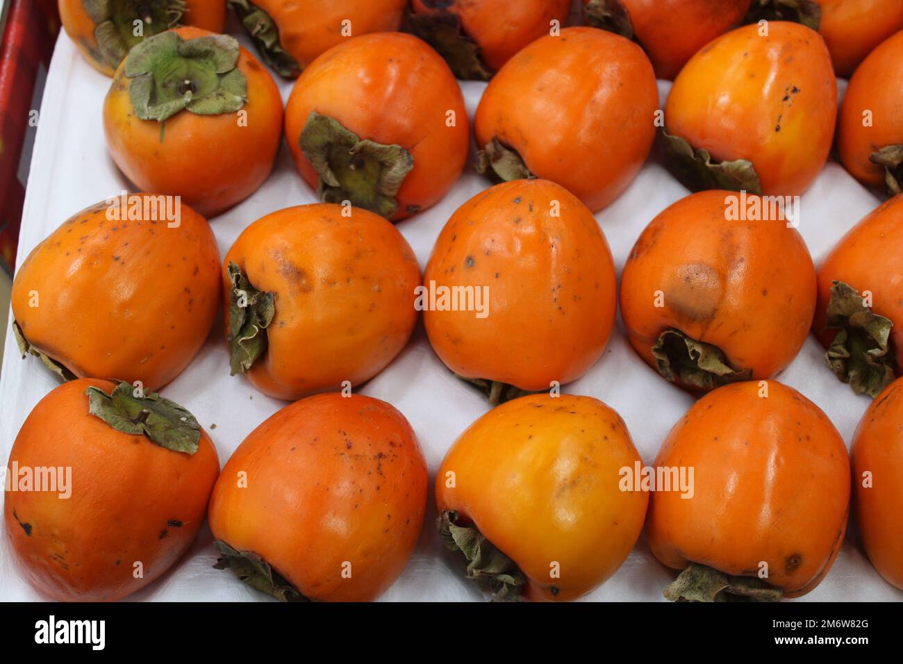 Asian persimmons hi-res stock photography and images - Alamy