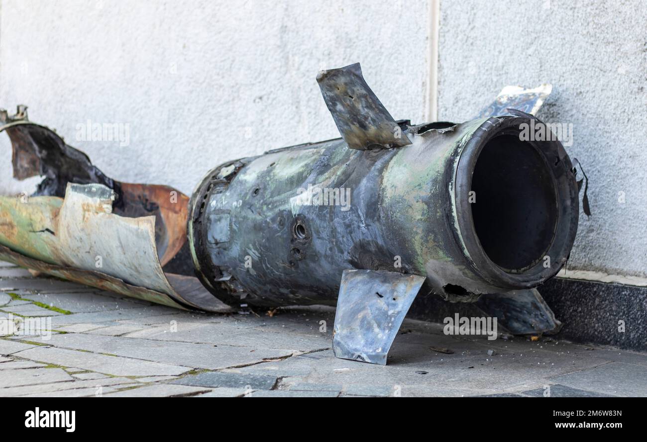 A metal fragment of a military rocket lies on the ground after the ...
