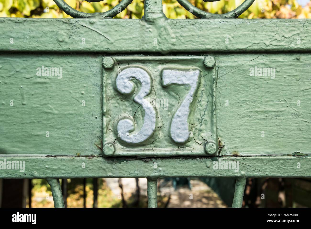 Old retro weathered cast iron plate with number 37 closeup Stock Photo ...