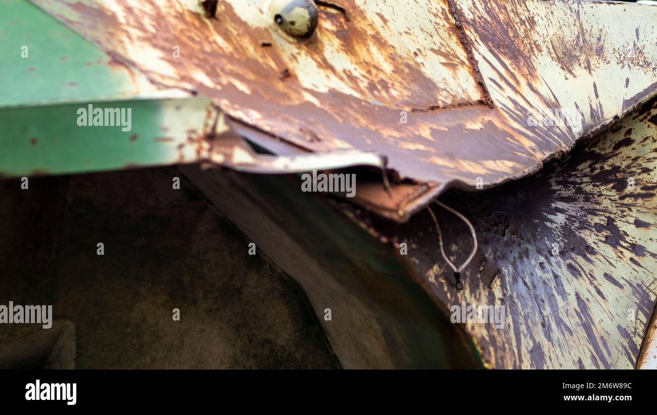 Hole or hole, armor deformation from a projectile close-up. Damaged ...