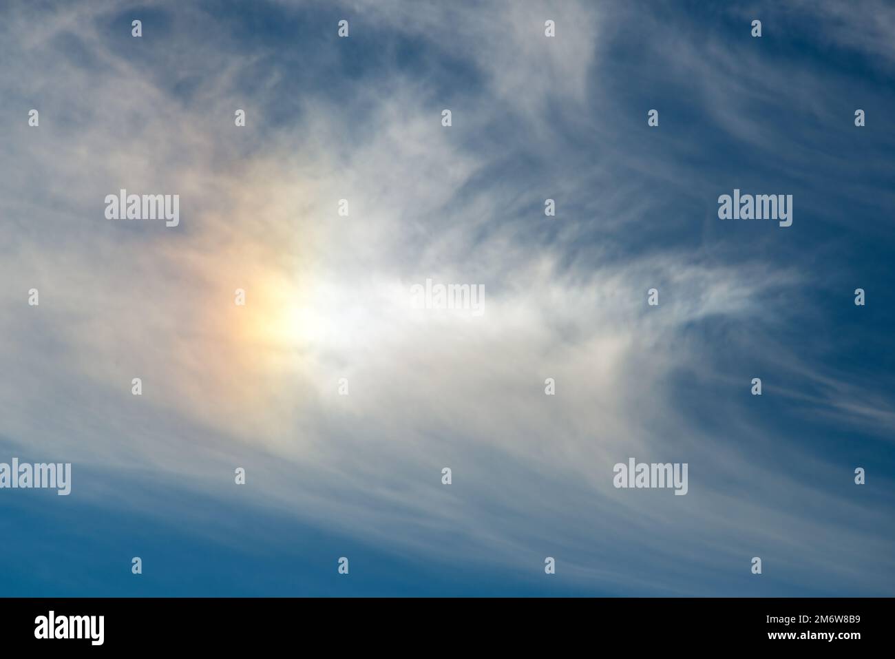 Light reflection in high clouds with blue sky Stock Photo - Alamy
