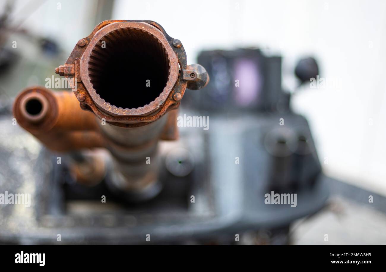 Tank gun, barrel muzzle of a military army close-up. Broken burnt tank ...