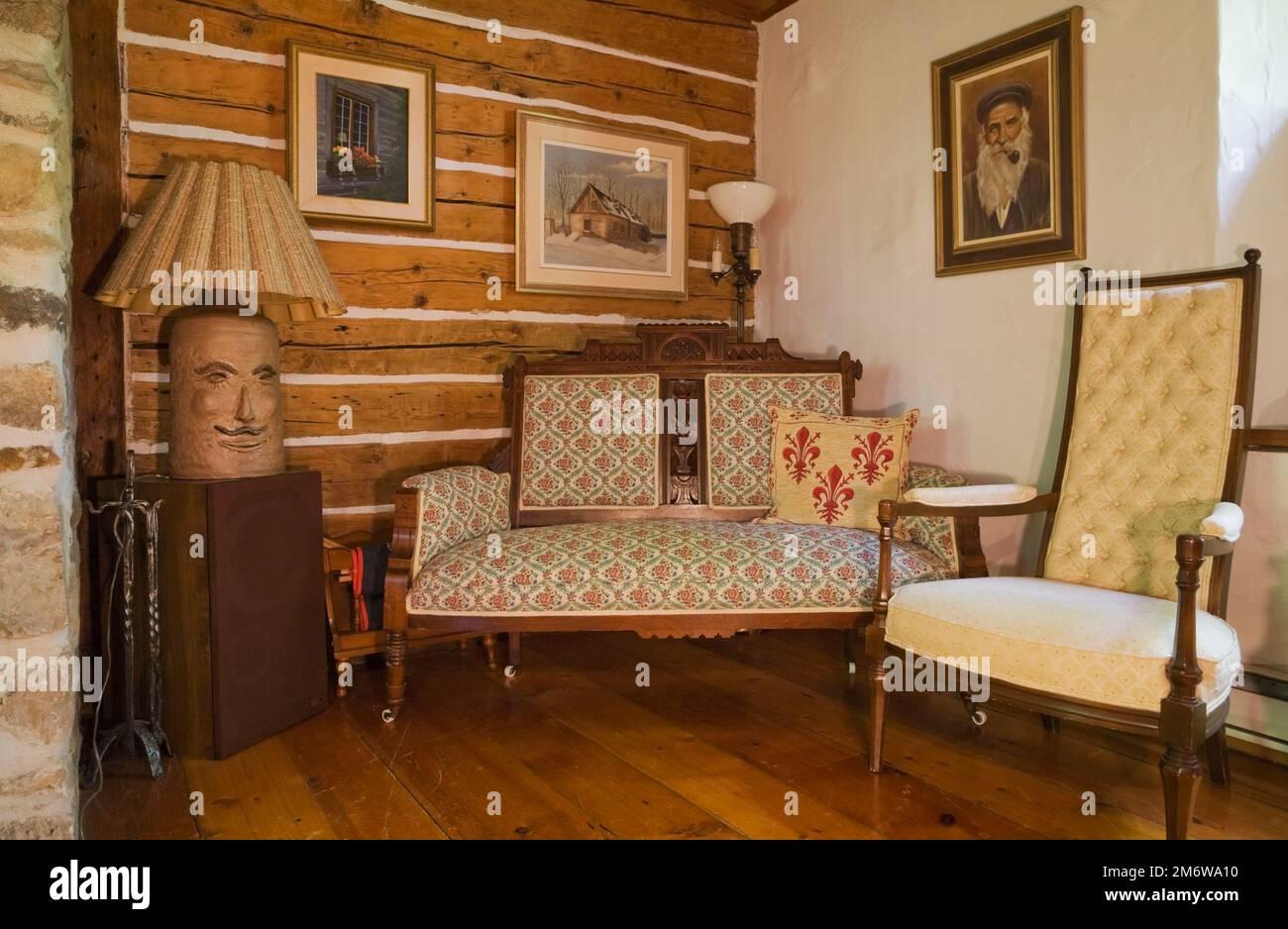 Upholstered armchair and sofa in living room inside 1980 reconstructed ...