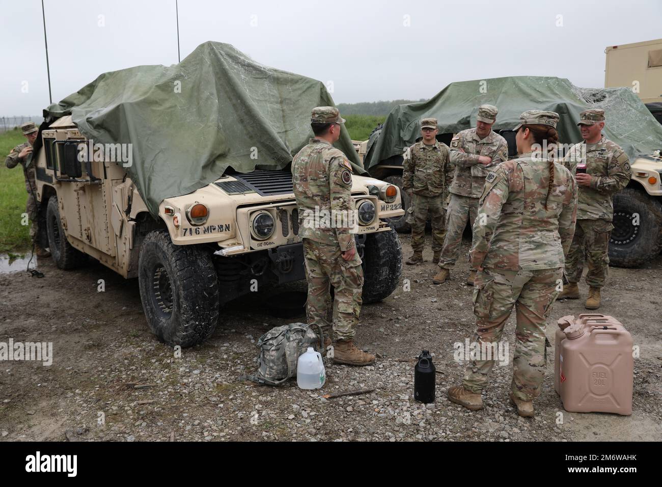 Soldiers assigned to the 504th Military Police Battalion discuss convoy ...