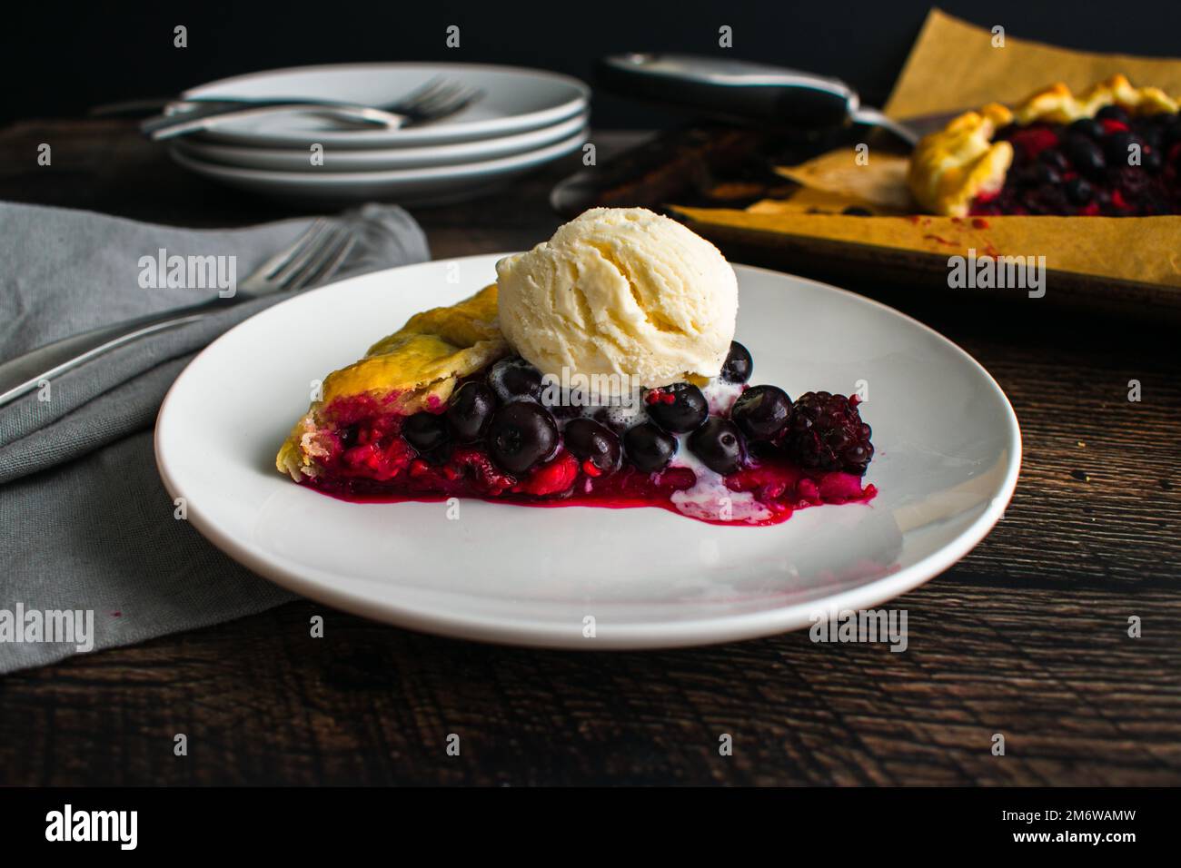 Slice of Mixed Berry Galette Topped with Vanilla Ice Cream: Rustic ...