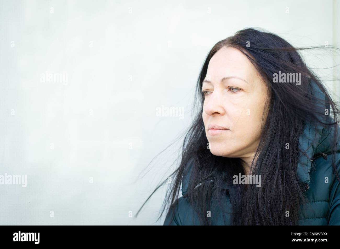 Resignated woman looking with a blank expression. Copy paste empty ...