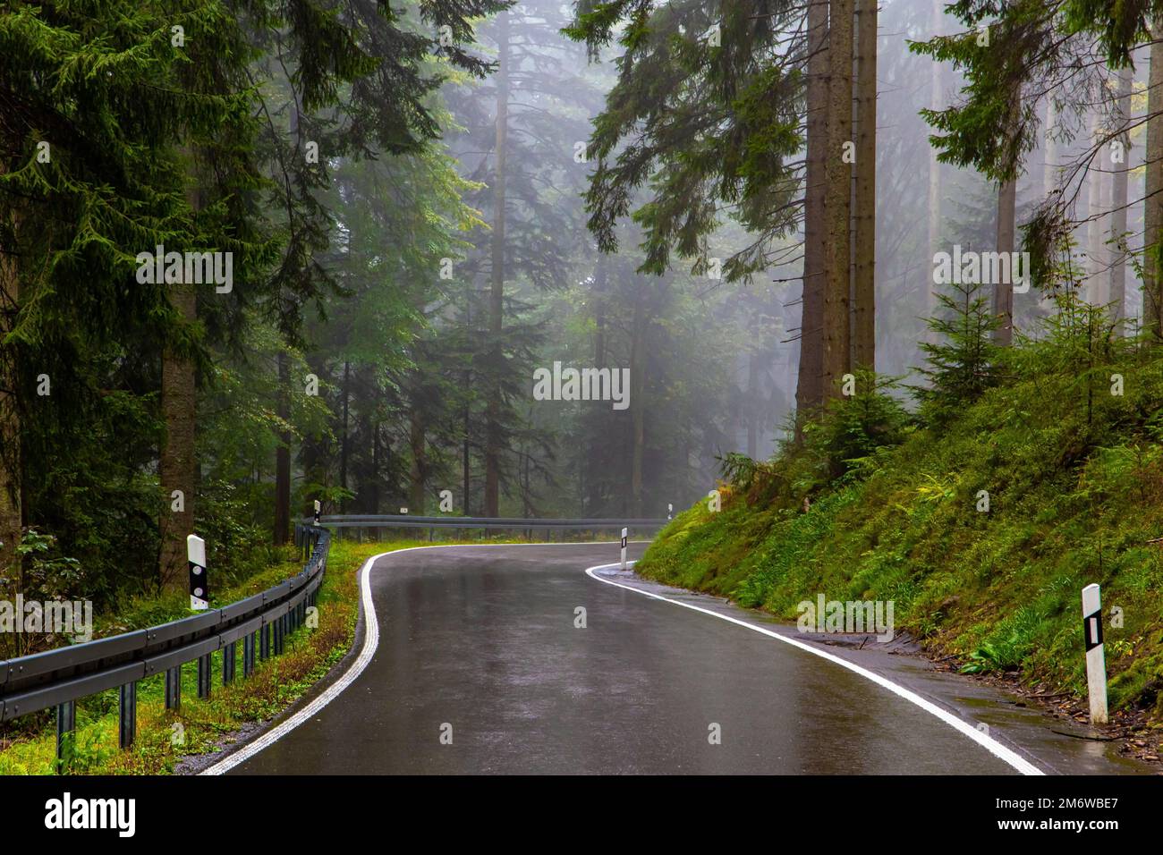 The smooth highway glistens with rain Stock Photo - Alamy
