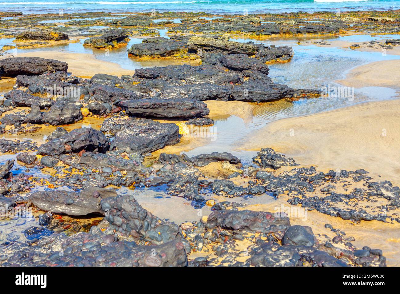 Volcanic rocks by the ocean . Coast Of Atlantic Ocean Stock Photo - Alamy