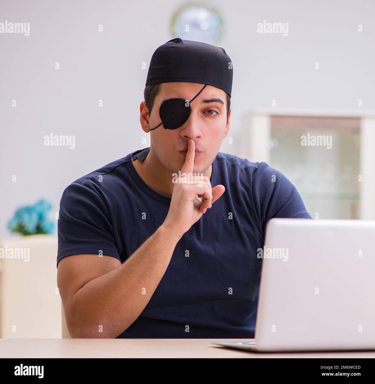 Digital security concept with pirate at computer Stock Photo - Alamy