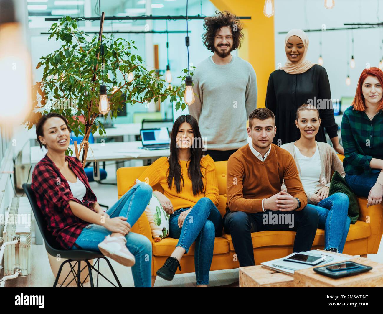 Group of multi-ethnic colleagues working on desktop computers, laptop ...