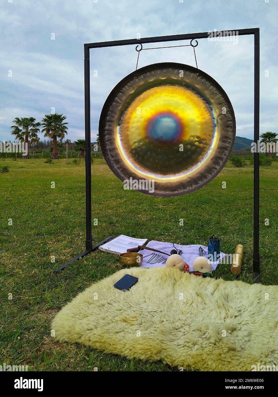 Gong instrument at fieldscape Stock Photo - Alamy
