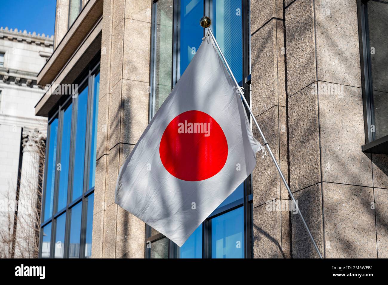Tokyo, Japan. 3rd Jan, 2023. A Japanese flag flying off an office ...