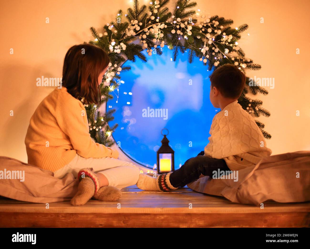 Cute children waiting for miracle on Christmas Eve at home, small kids ...