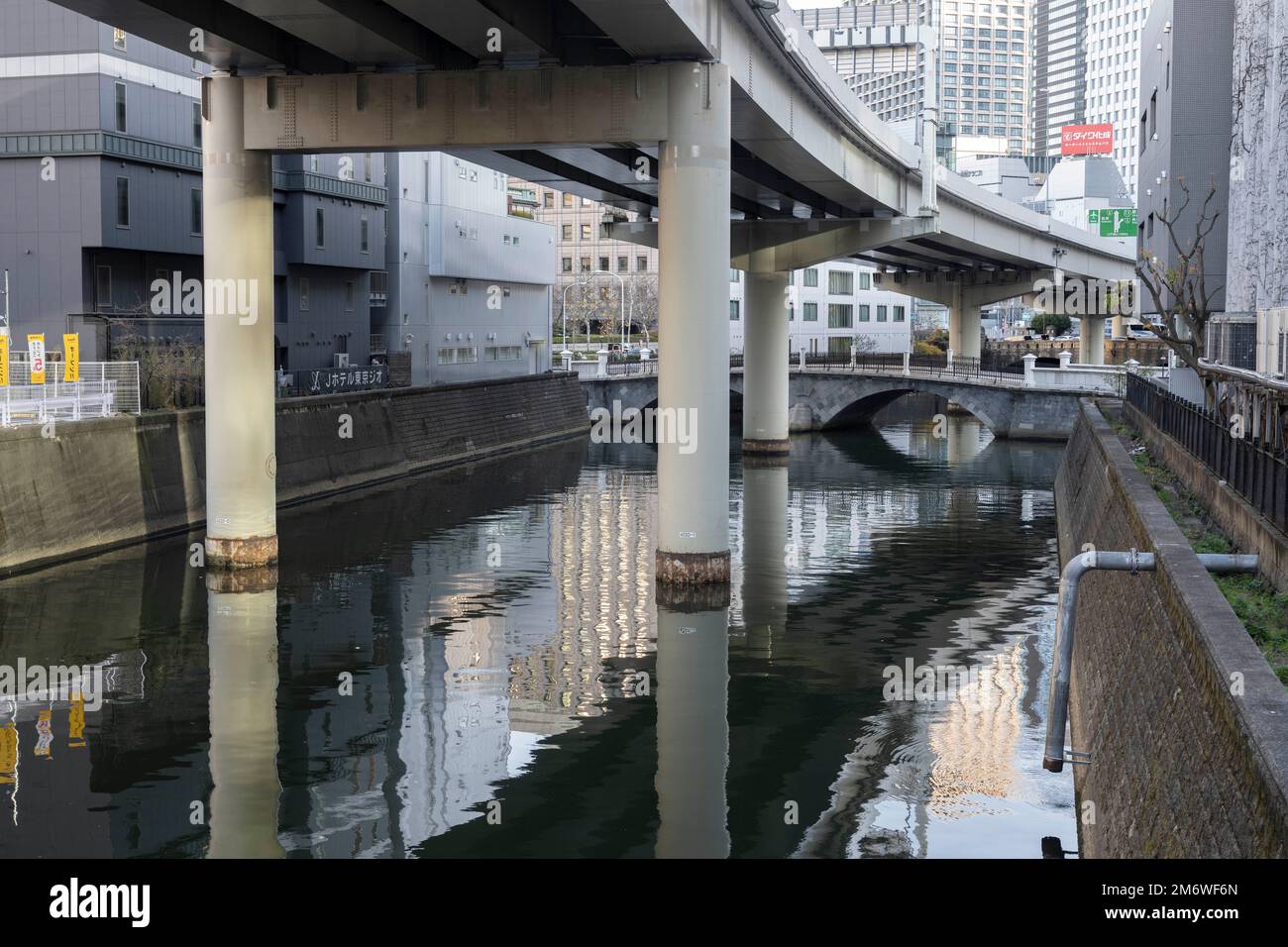 Tokyo, Japan. 3rd Jan, 2023. A freeway overpass built over the Kanda ...