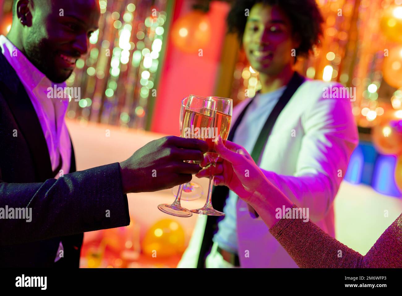 Three people making a toast hi-res stock photography and images - Alamy