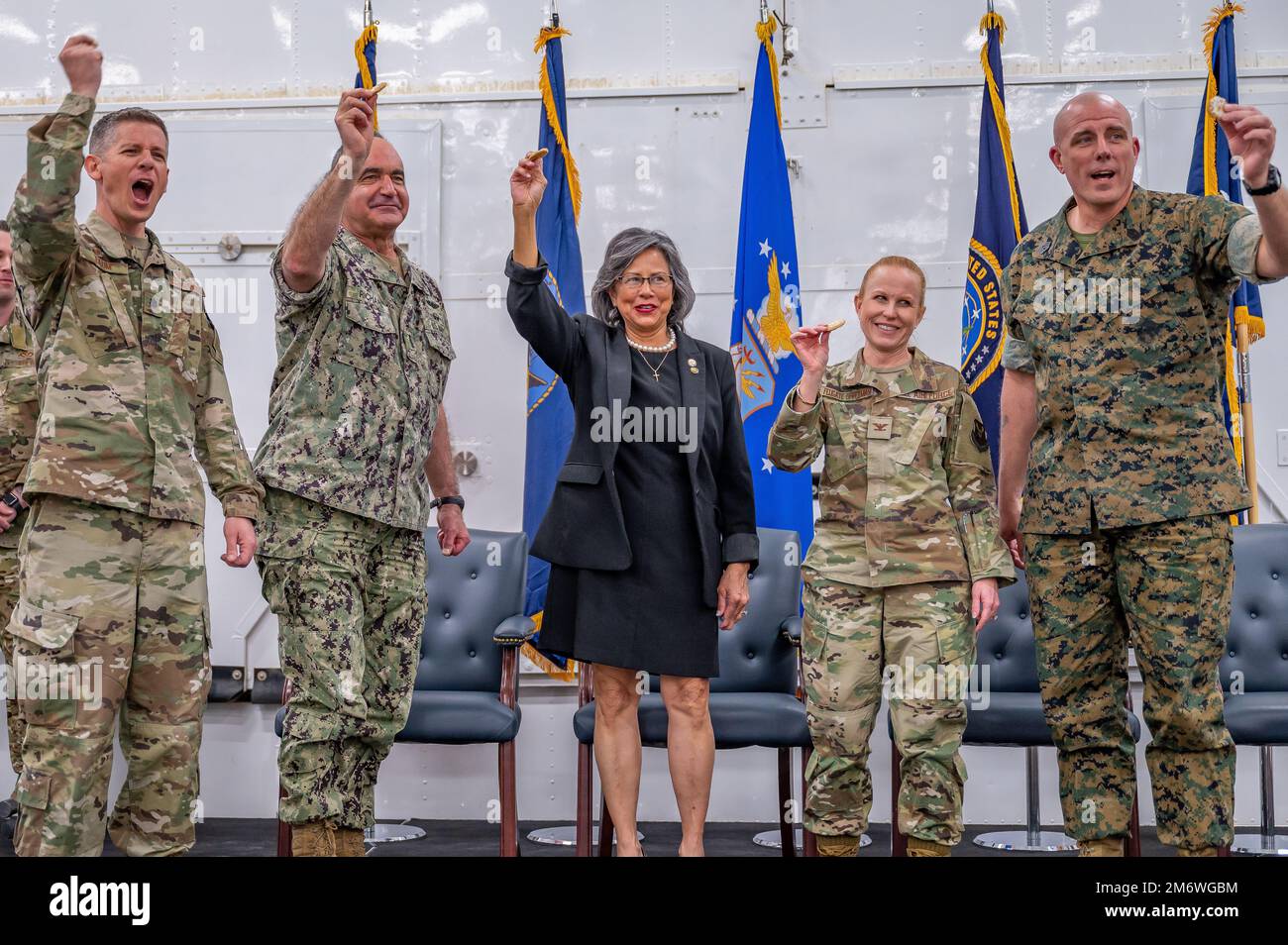 From the left, Lt. Col. Aaron Baum, 12th Missile Squadron commander; U ...