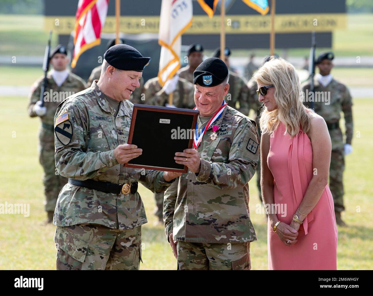 Col. Stephen Aiton, smiles broadly as he reads his retirement ...