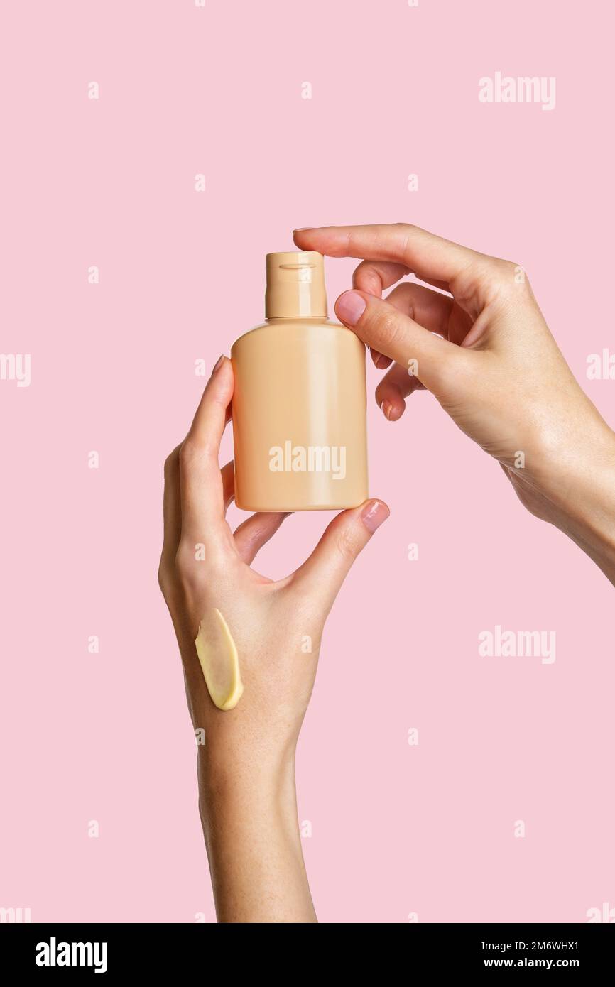 Woman hand showing cream product. Cosmetic product branding mockup ...