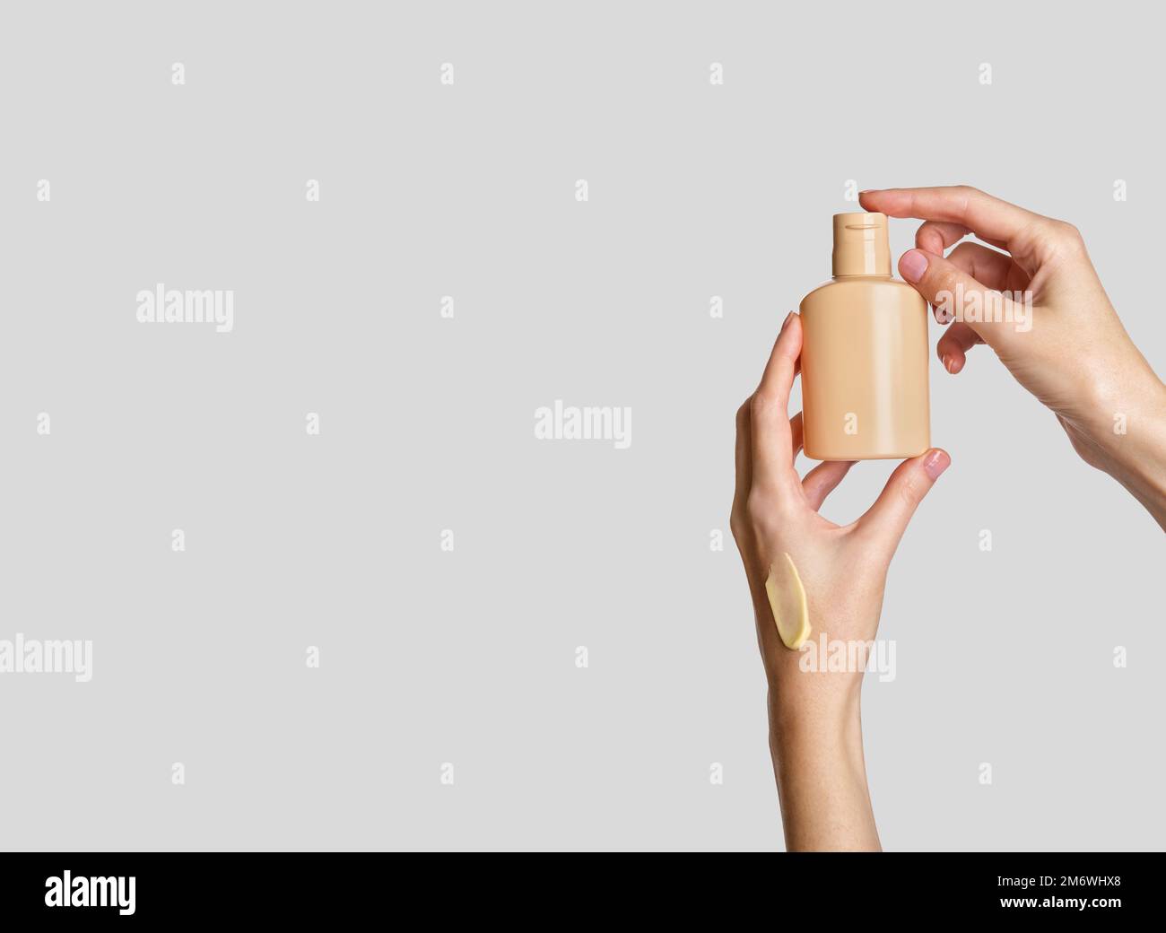 Woman hand showing cream product. Cosmetic product branding mockup ...