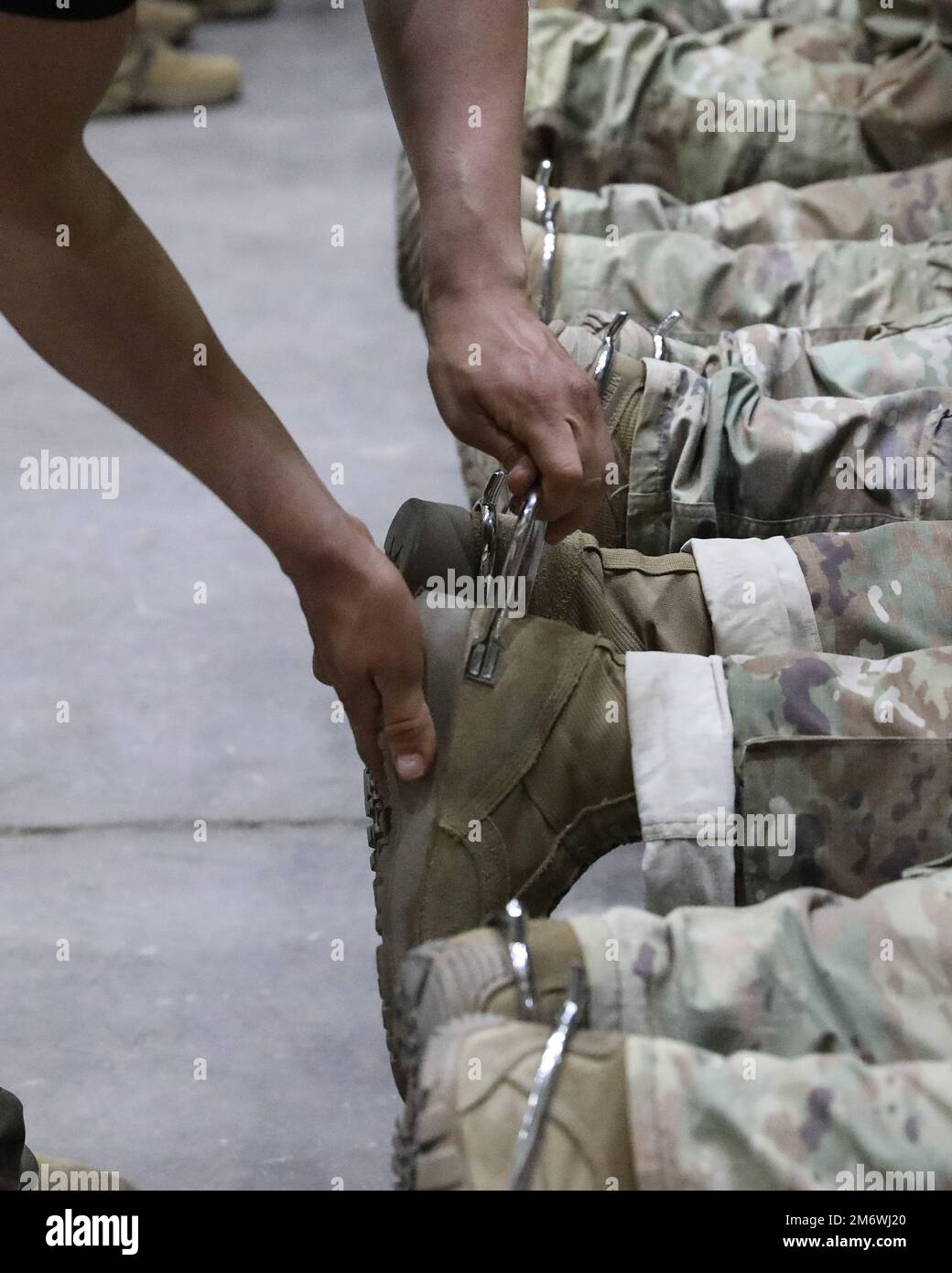 A candidate receives their silver spurs after successful completion of ...