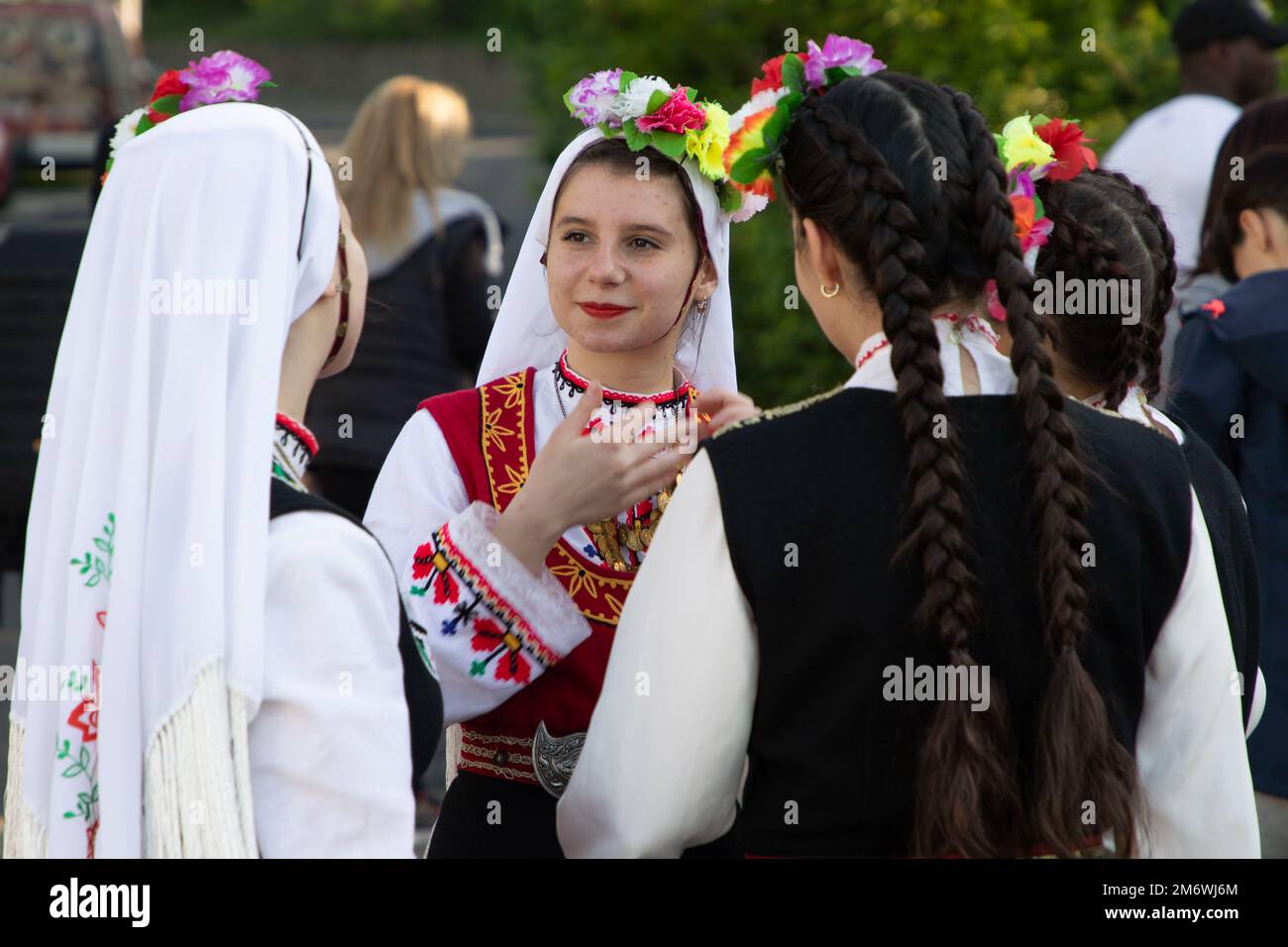 Bulgarian locals dressed in Nosiya, or traditional garments, prepare to ...