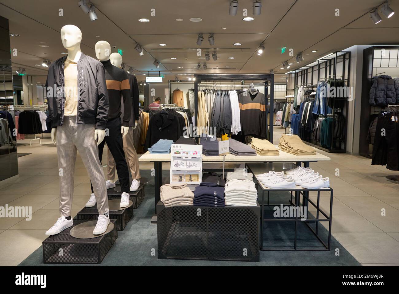 SHENZHEN, CHINA - CIRCA NOVEMBER, 2019: apparel on display at H and M ...