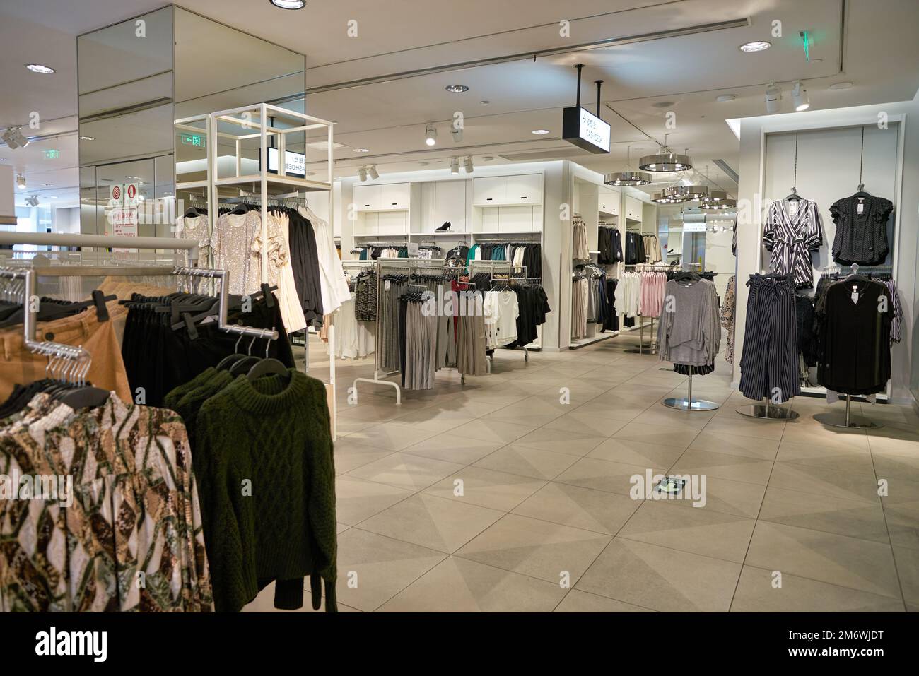 SHENZHEN, CHINA - CIRCA NOVEMBER, 2019: apparel on display at H and M ...