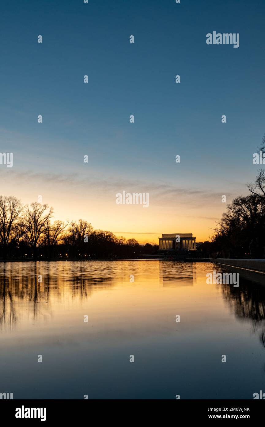 Sunset view with water reflection of the Lincoln Memorial, the monument ...