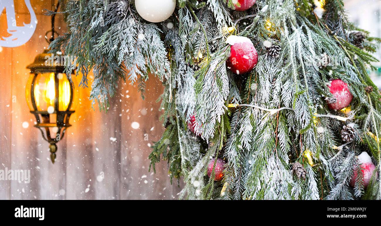 Outdoor Christmas decorations made of natural spruce branches, toys ...