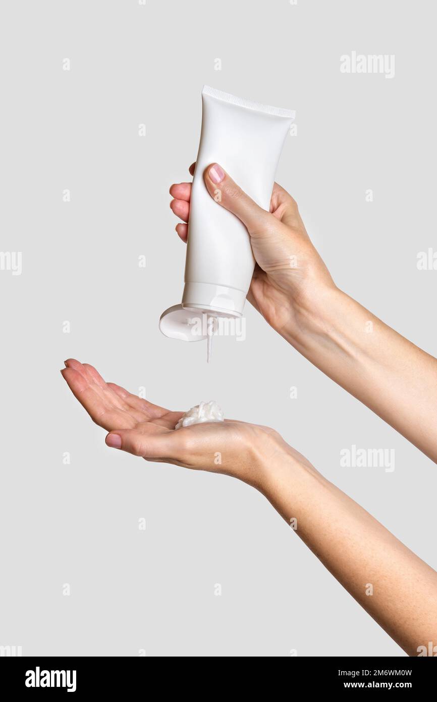 Woman pouring lotion into hand. Cosmetic product branding mockup. Daily ...