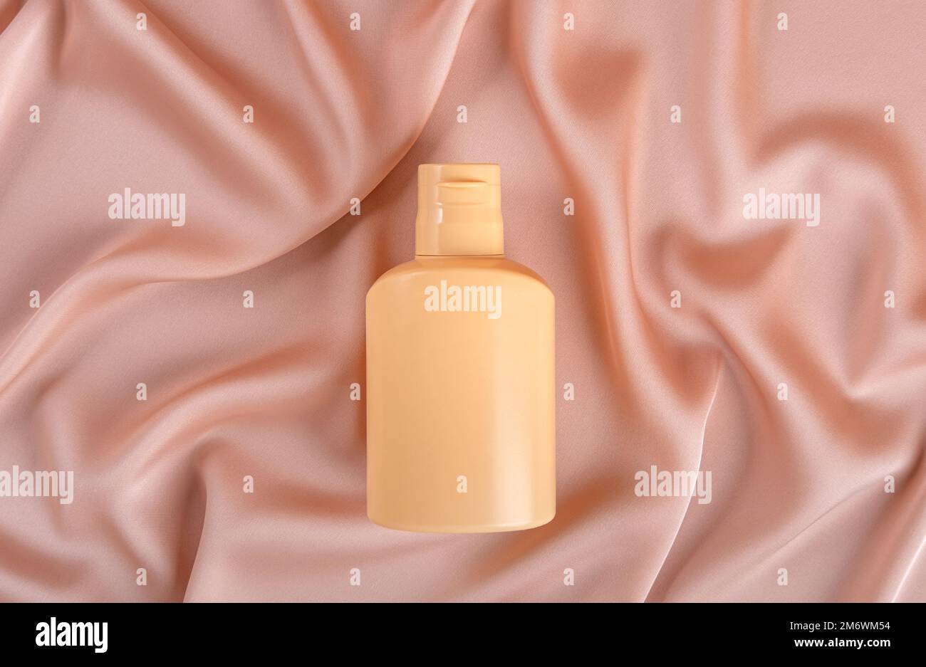 Bottle cosmetic product on pastel textile background. Beauty product ...