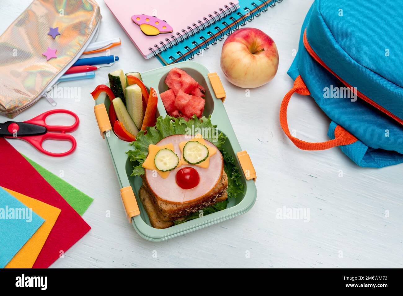 School lunch box for kids with food in the form of funny faces. School ...