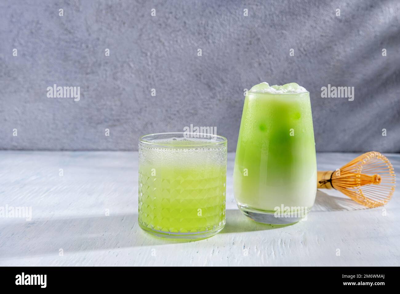 Matcha tea. Iced green tea matcha latte in glass. Whipped grean tea ...