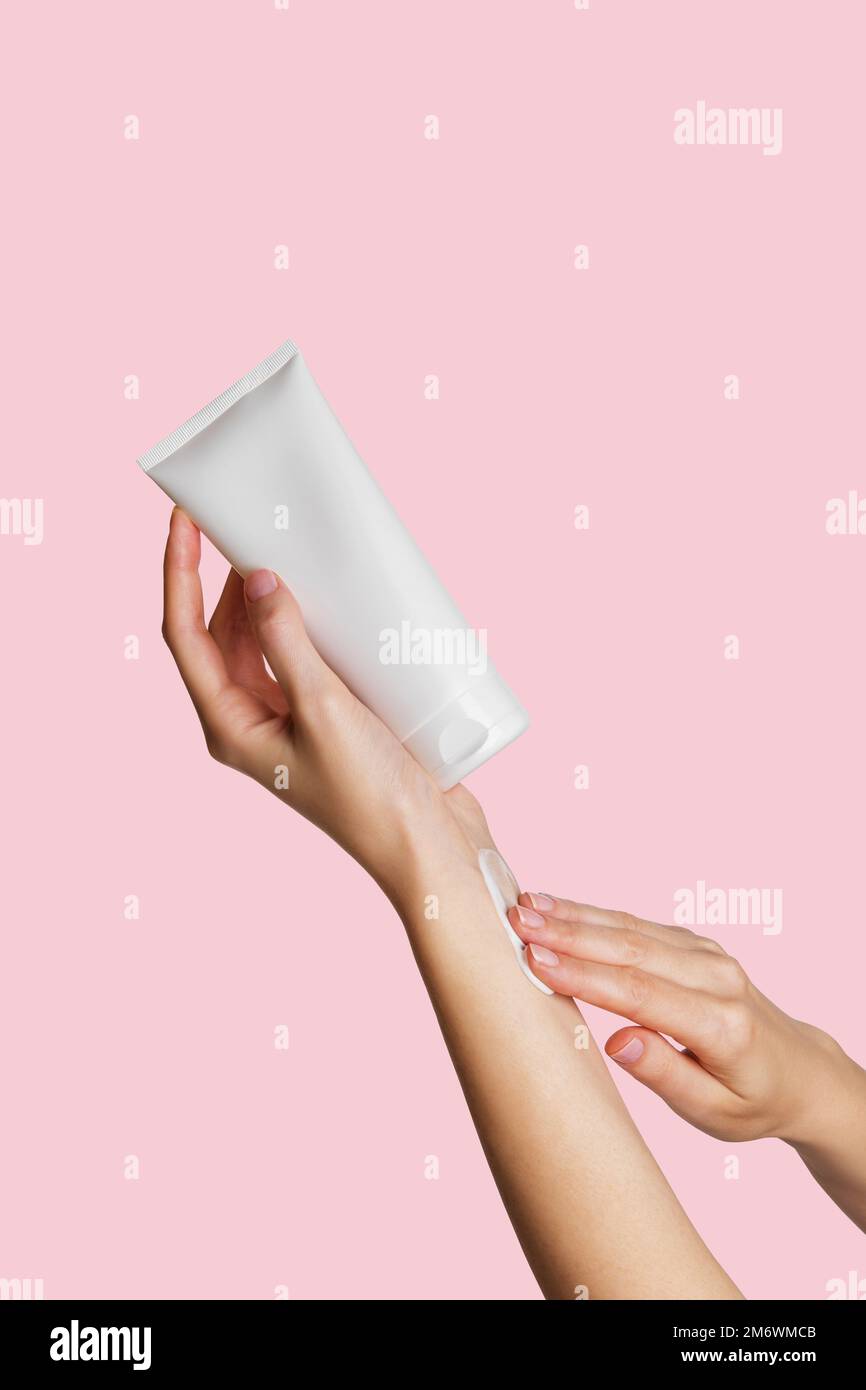 Woman applying lotion to hand. Cosmetic product branding mockup. Daily ...