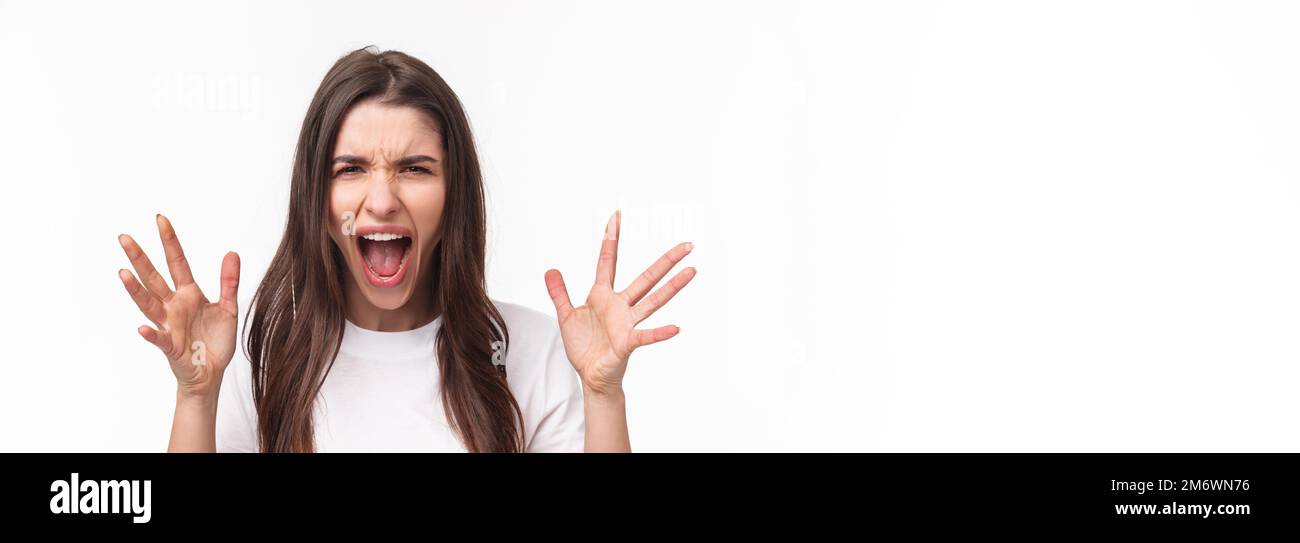 Close-up portrait of angry, pissed-off aggressive woman screaming at ...