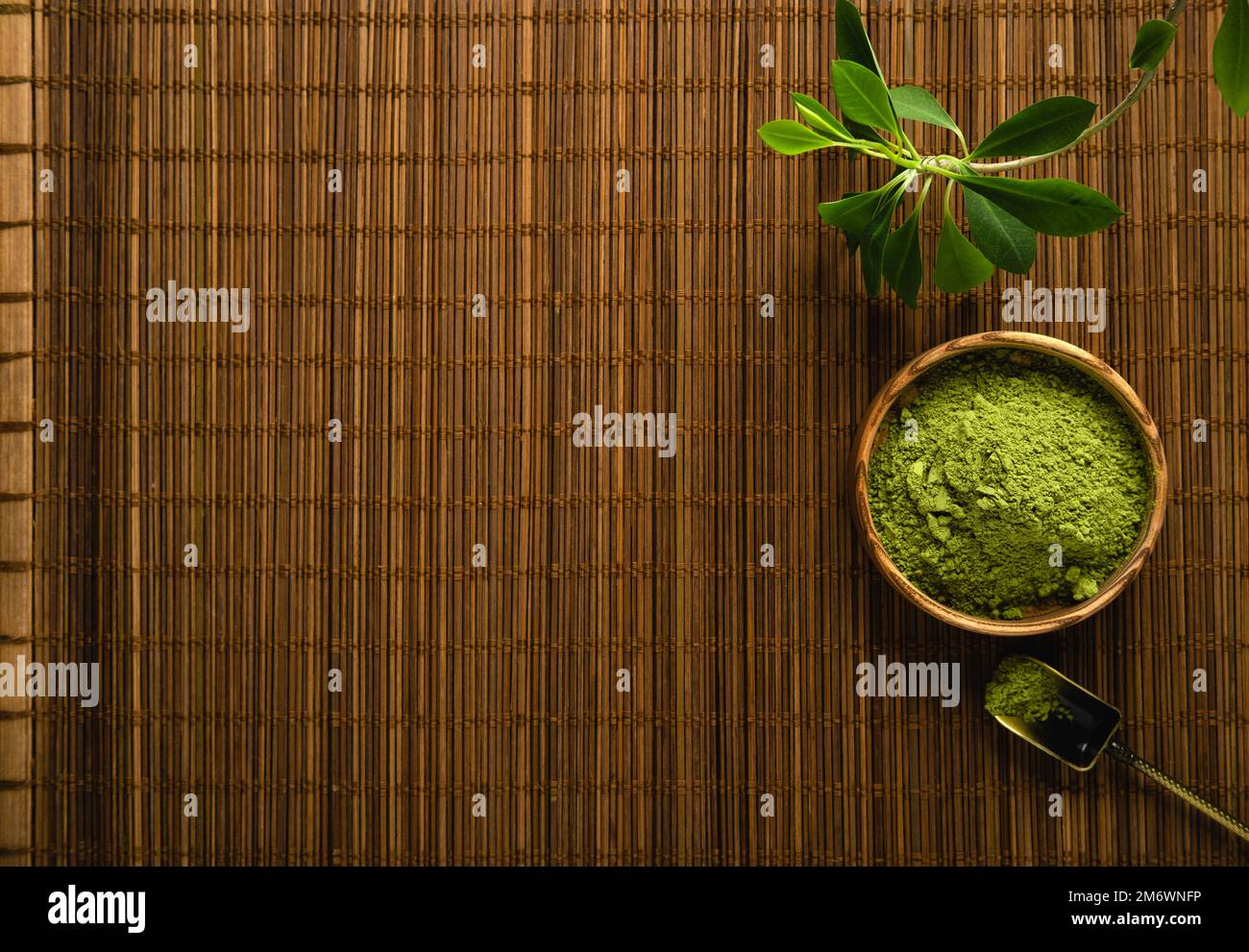 Matcha tea powder and tea accessories on bamboo napkin background. Tea ...