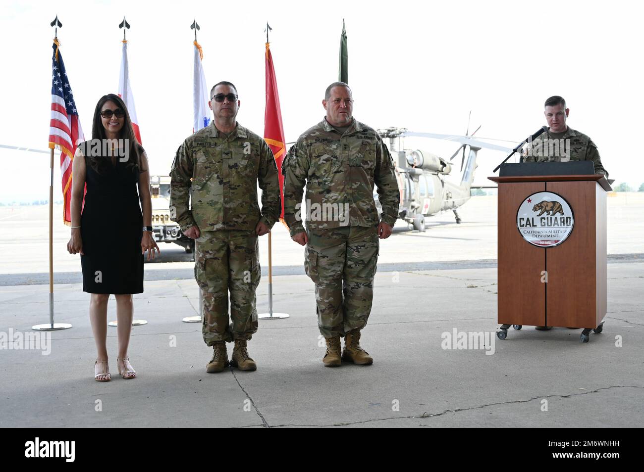 U.S. Army Col. Robert Paoletti stands at attention with his wife ...
