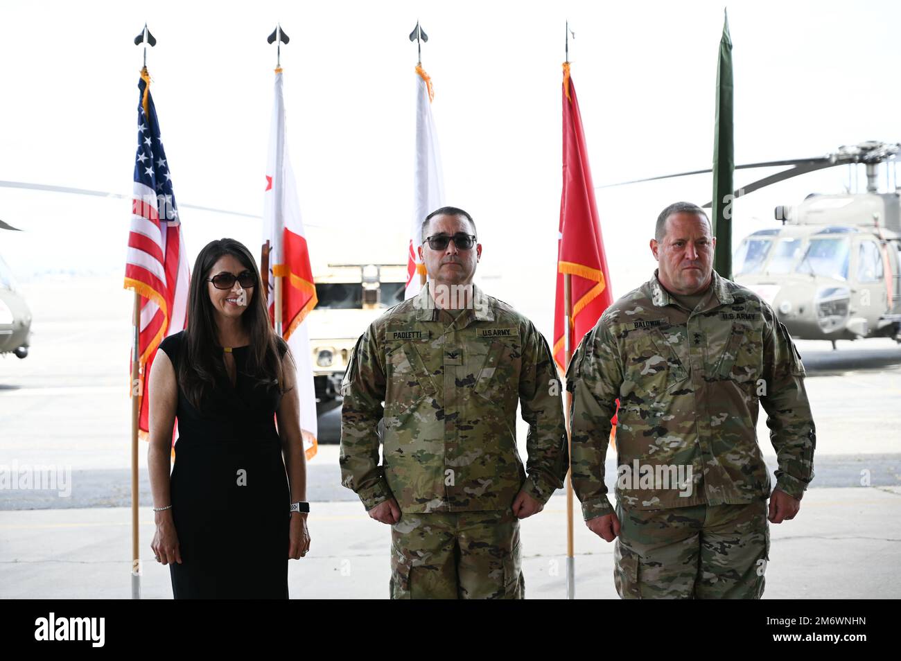U.S. Army Col. Robert Paoletti stands at attention with his wife ...