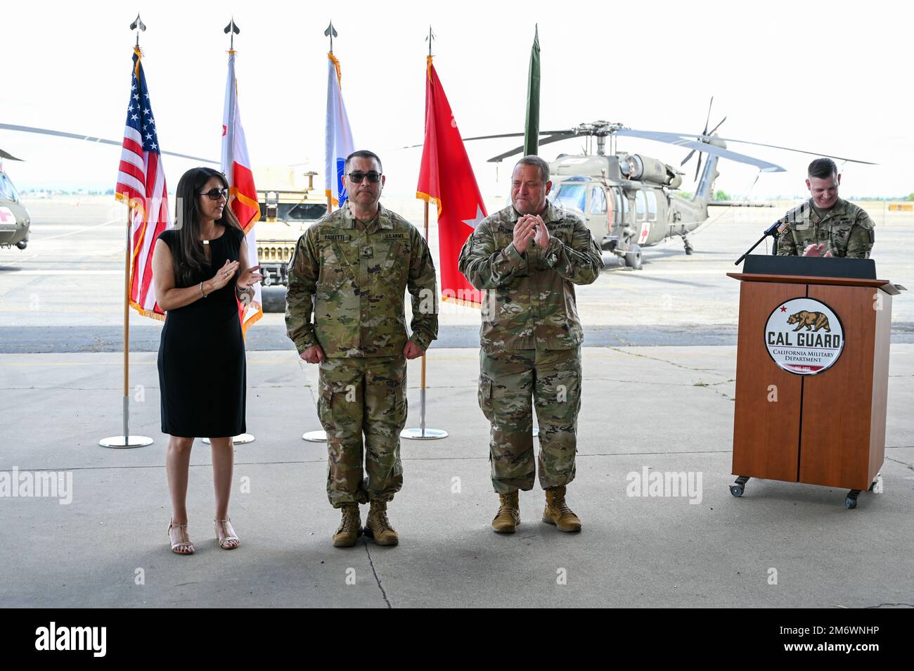 U.S. Army Brig. Gen. Robert Paoletti stands at attention after his wife ...