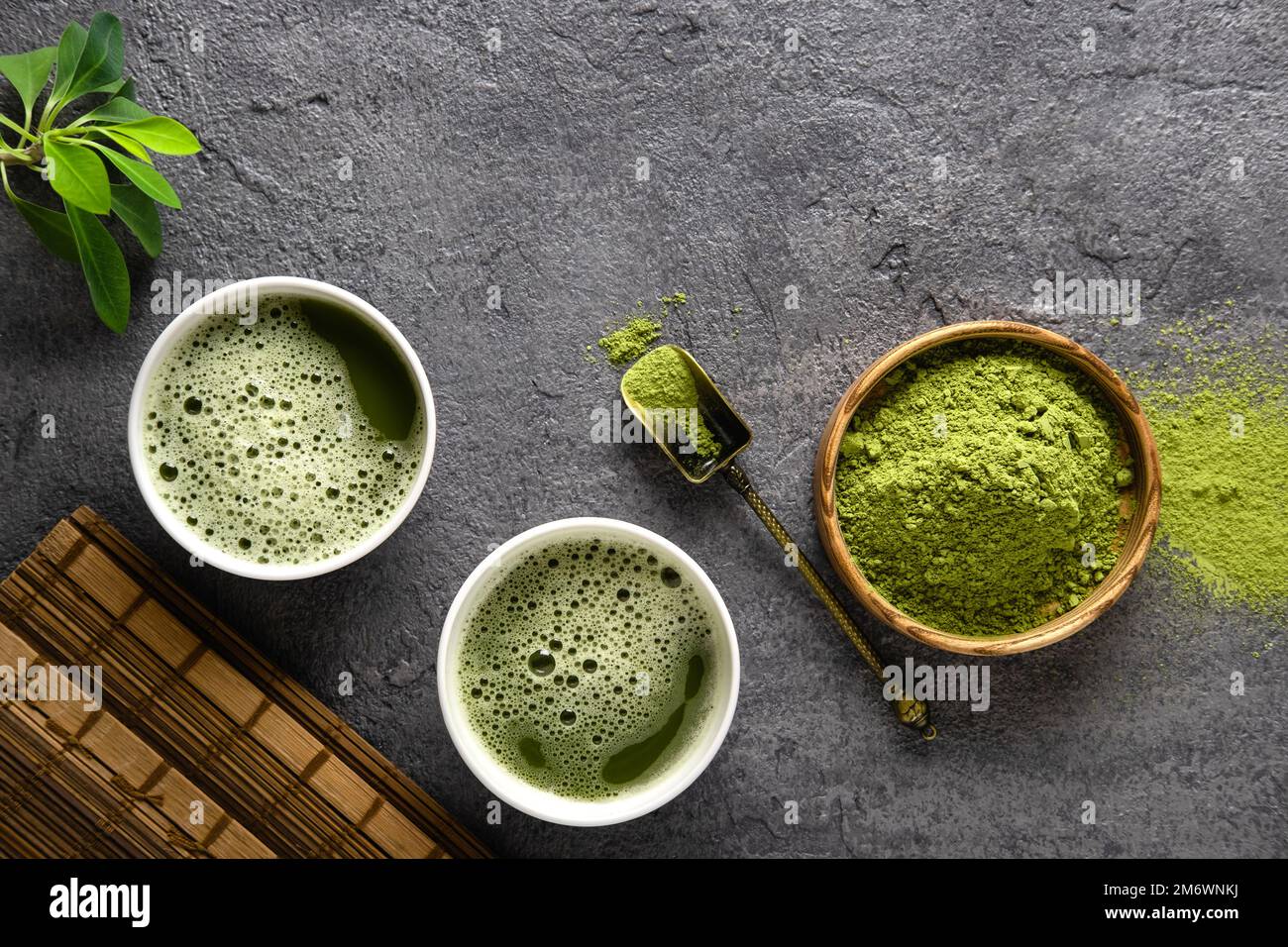 Matcha tea powder and tea accessories on dark background Stock Photo ...