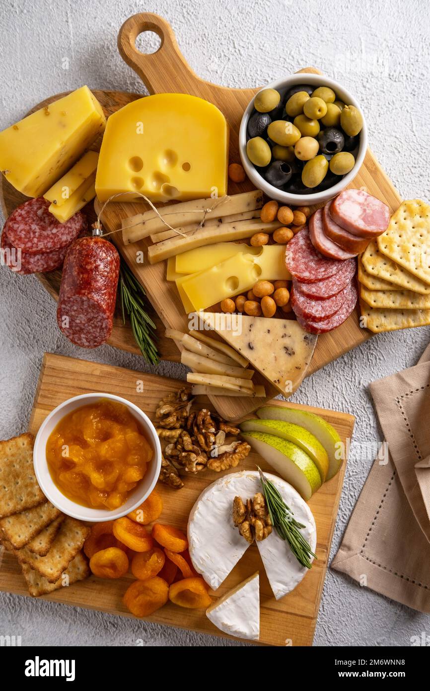 Different types of cheeses and cold cut meats. Top view on a white ... Different types of cheeses and cold cut meats. Top view on a white ...