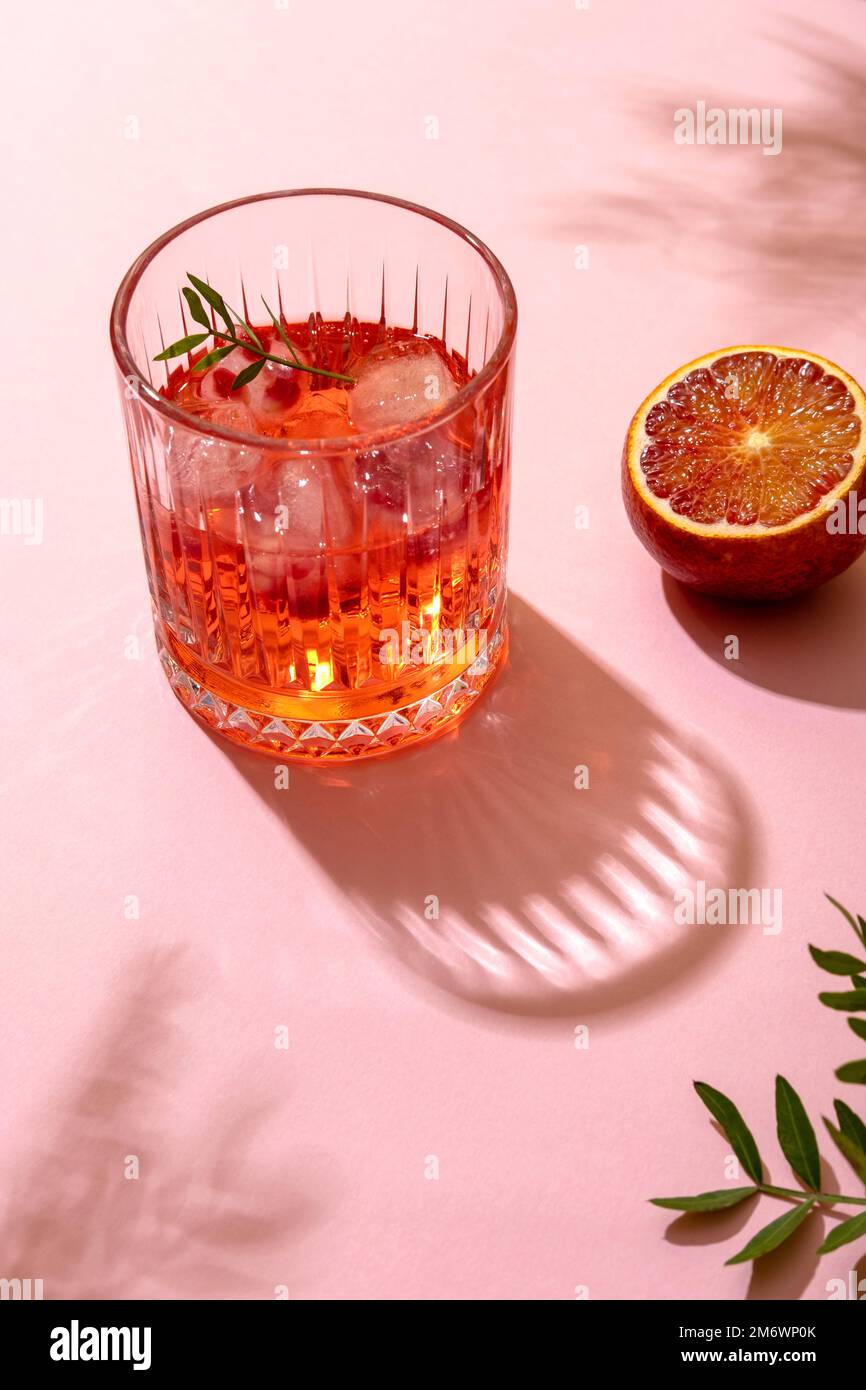 Summer ice alcoholic cocktail served under the summer sun light, view ...